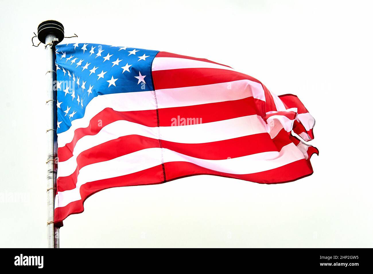 American flag hanging on pole hi-res stock photography and images - Alamy