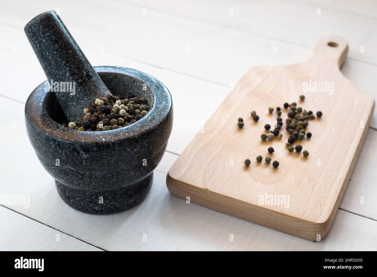 peppercorns of black and color pepper with granite mortar Stock Photo ...