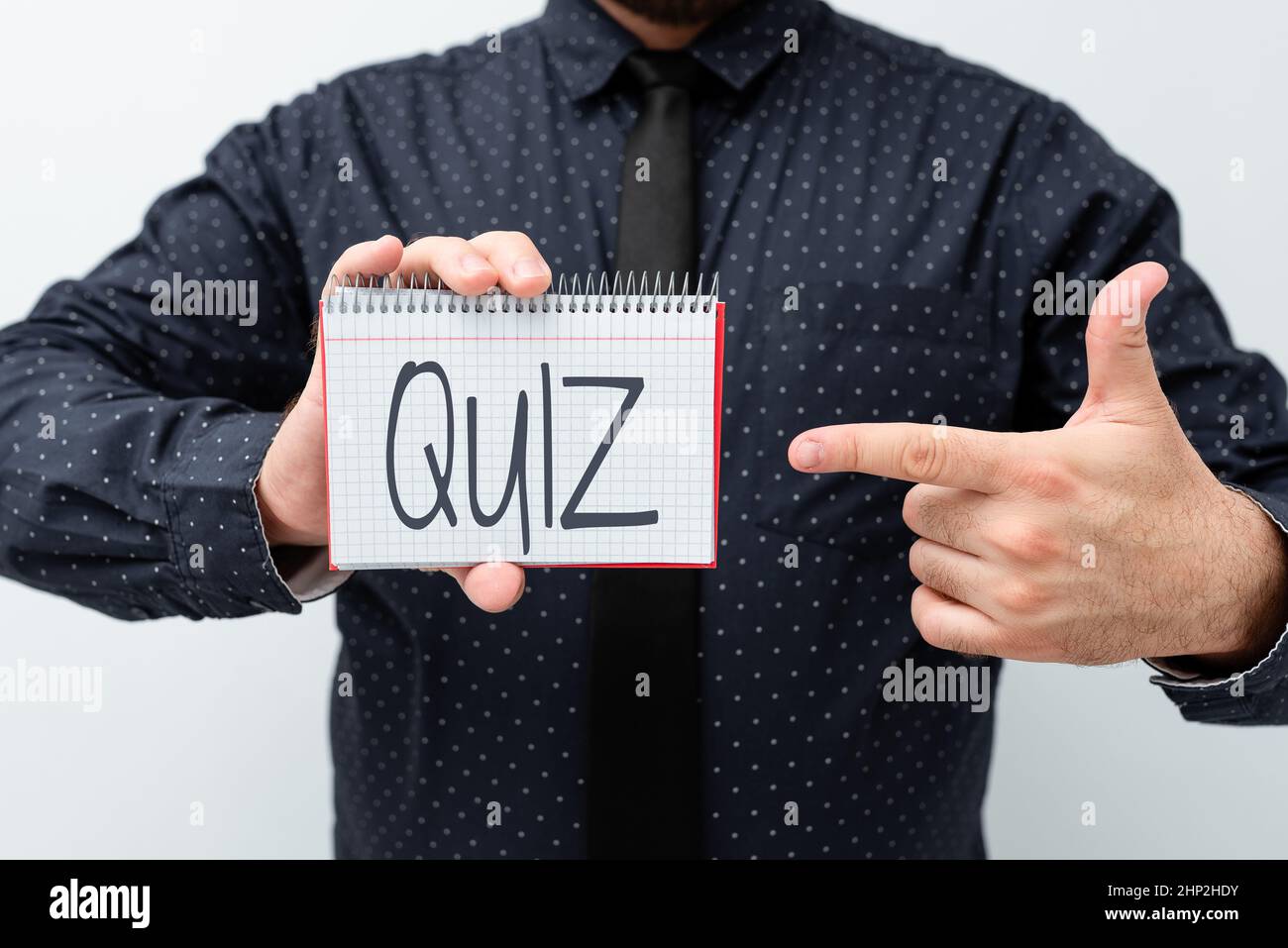 Hand writing sign Quiz, Word for Brief informal test given to students ...