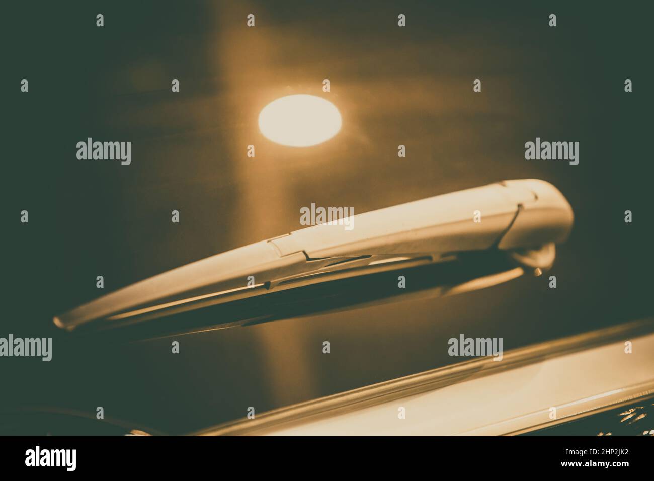 Close up shot of a modern new rear screen wiper on a car's windshield ...