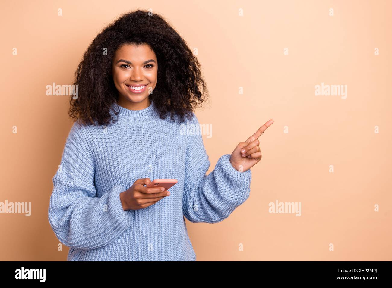 Photo of young cheerful girl indicate finger empty space ads promo use ...