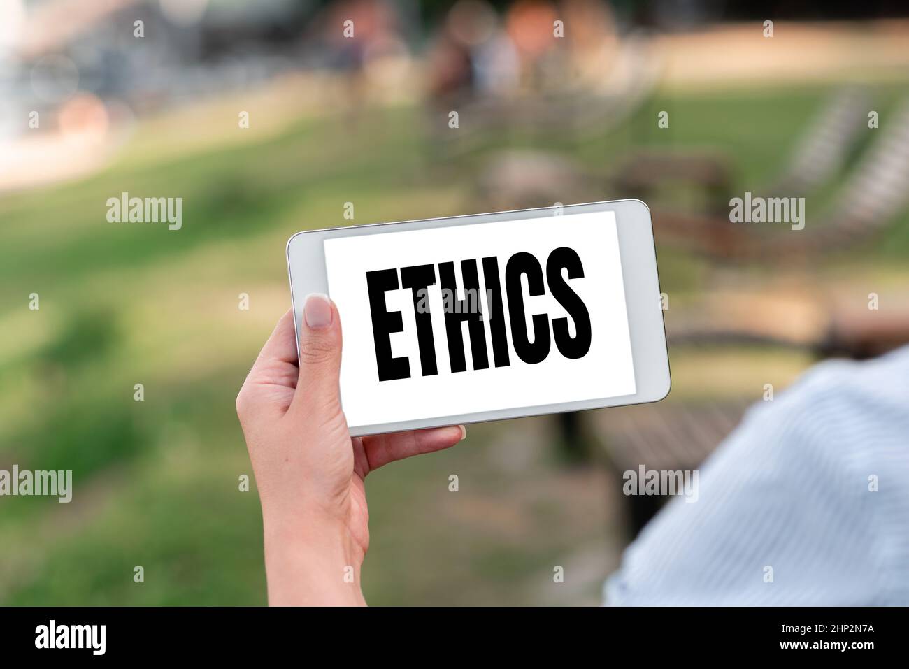 Hand writing sign Ethics, Word Written on the moral philosophy or code ...