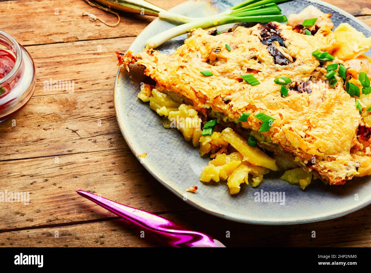 Veal, potato and cheese casserole. Meat gratin with potatoes and cheese ...