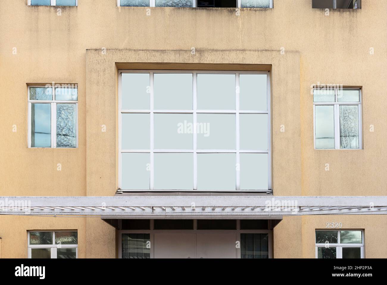 entrance apartment windows exterior Stock Photo - Alamy