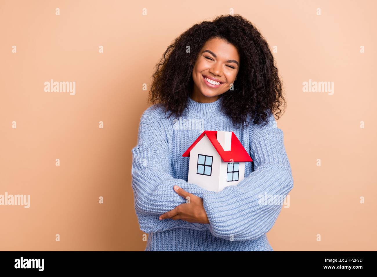 Photo of young cheerful girl hug cuddle house relocation property ...