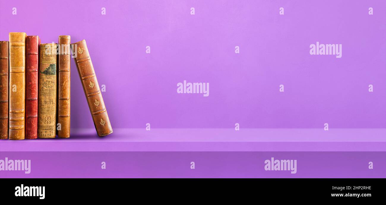 Purple books on bookshelf hi-res stock photography and images - Alamy