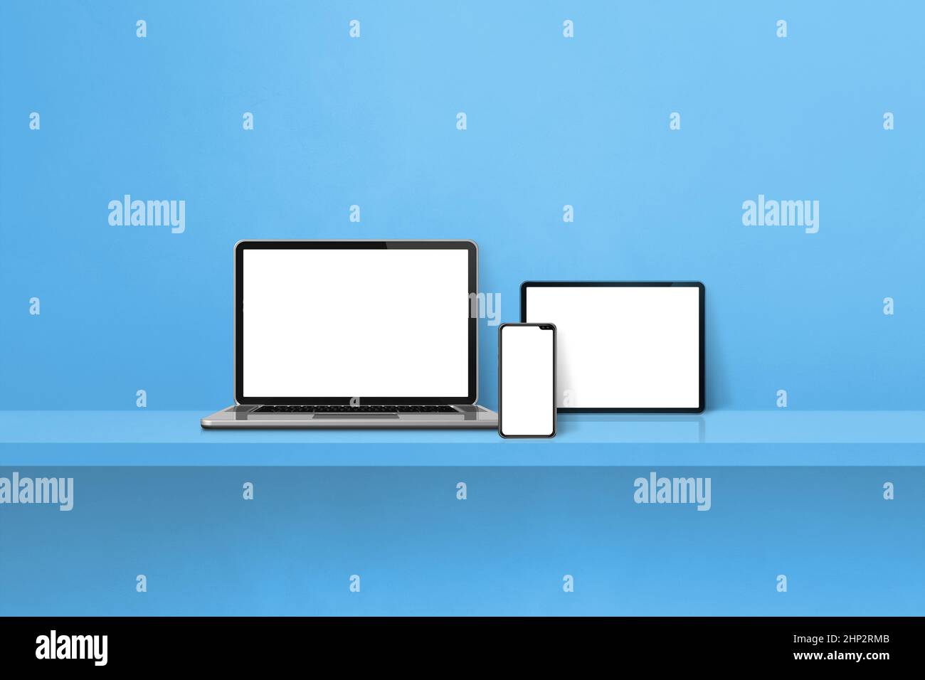 Laptop, mobile phone and digital tablet pc on blue wall shelf ...