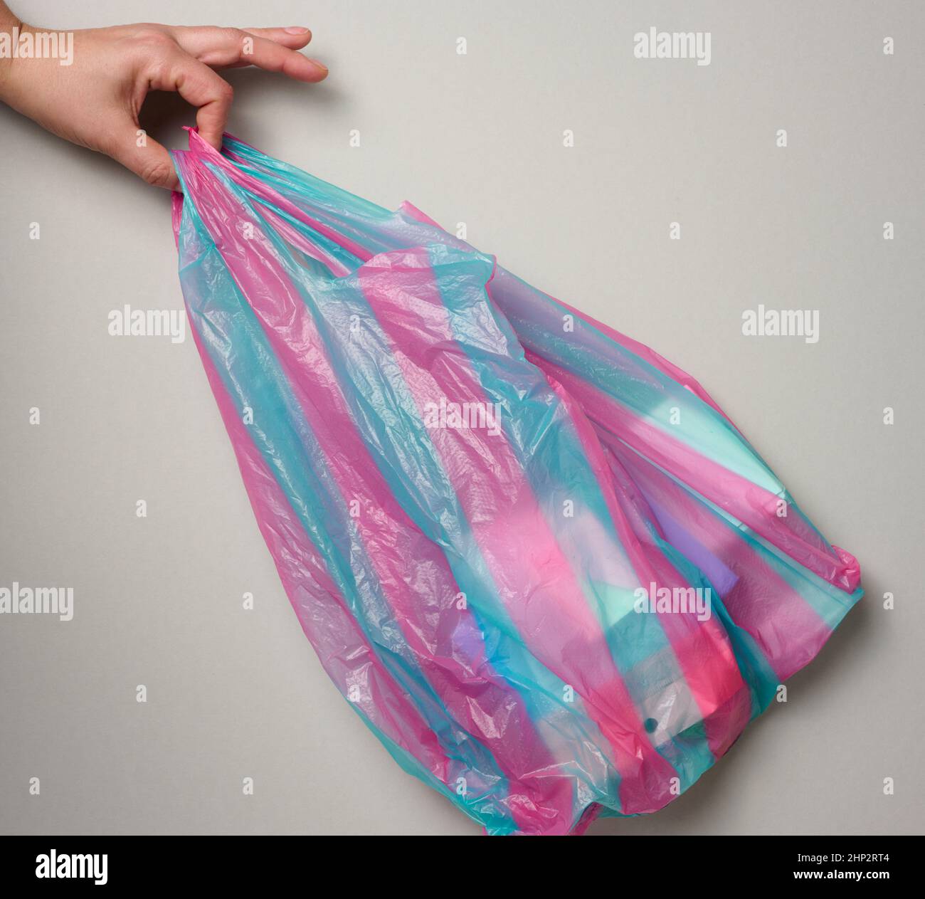 Hand full plastic rubbish hi-res stock photography and images - Alamy