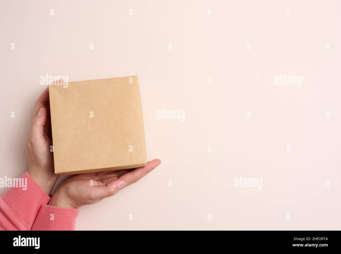 Female hands holding square hi-res stock photography and images - Alamy