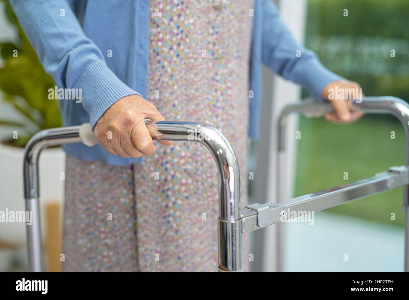 Asian senior or elderly old lady woman patient walk with walker at ...