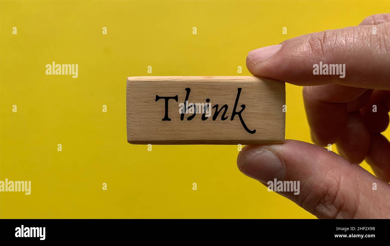 Wooden block with the word Think. Business and decision making concept ...