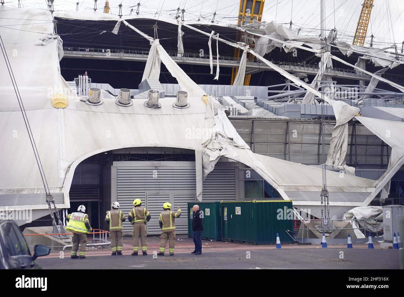 Emergency services look at the damage to the roof of the O2 Arena ...