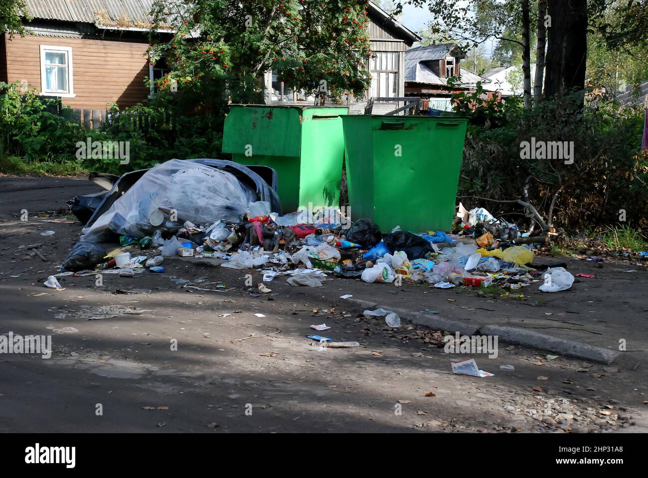 metal garbage cans are in a pile of garbage. High quality photo Stock ...