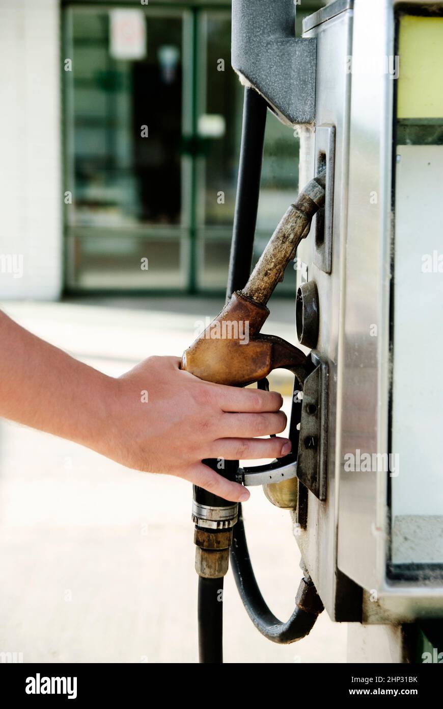 Man hand holding fuel pump Stock Photo - Alamy