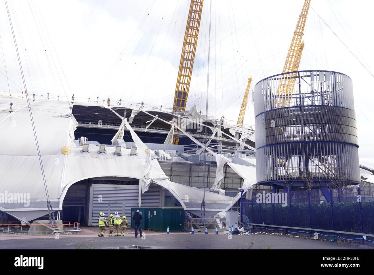Emergency services look at the damage to the roof of the O2 Arena ...
