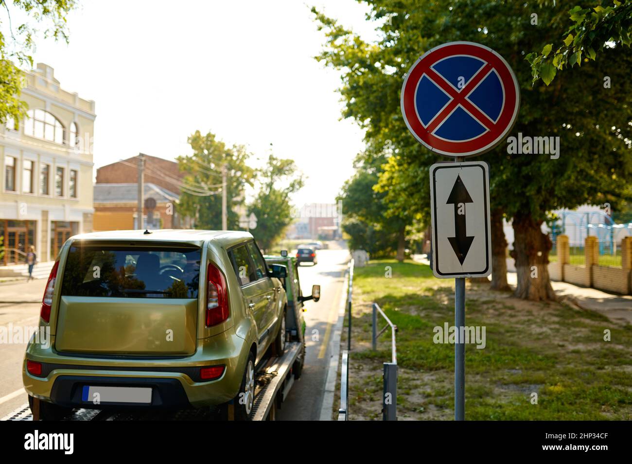 Improper parked car evacuation by tow truck. Roadside assistance and ...