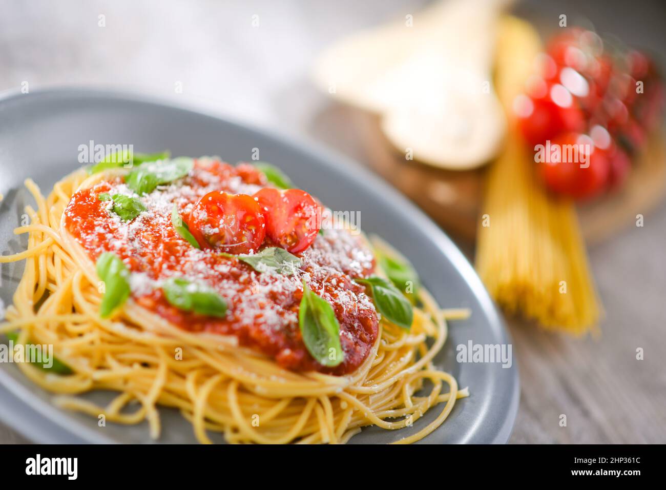 Composition with a plate of spaghetti bolognese Stock Photo - Alamy