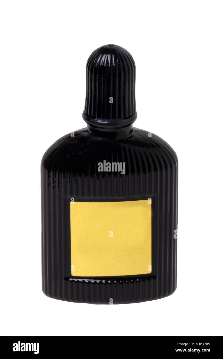 Cosmetic labels. Close-up of a black elegant male parfum glass bottle ...