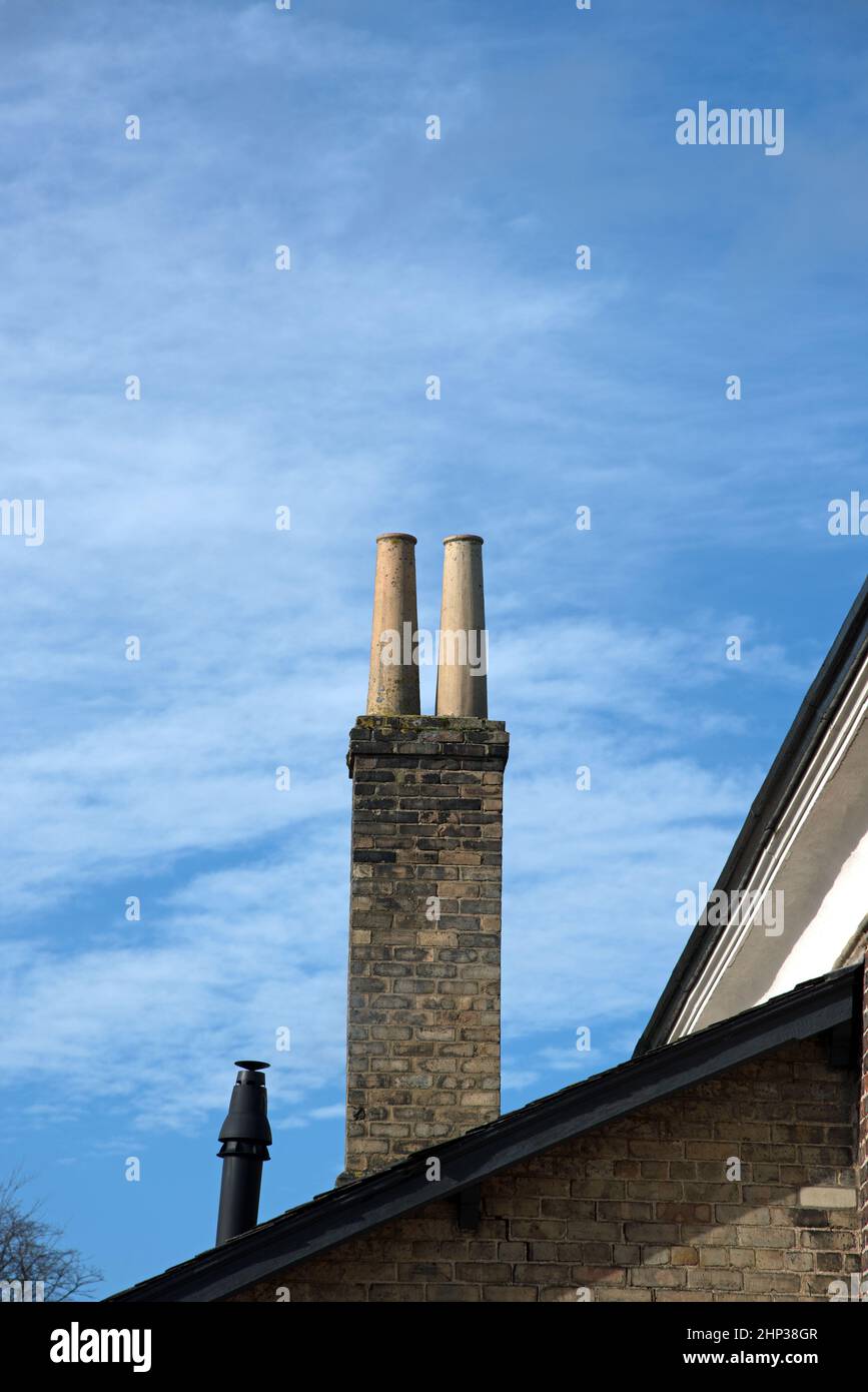 Twin Chimney on brick chimneystack also showing heating vent and ...