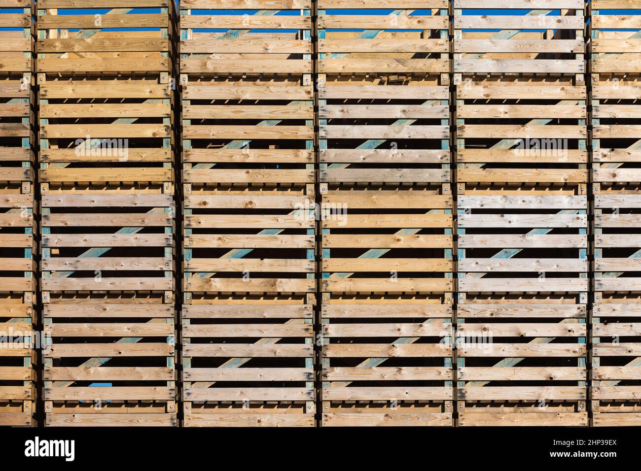 Stack of blue wooden pallets hi-res stock photography and images - Alamy