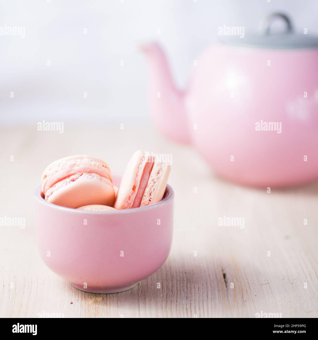 Pink macarons in a bright neutral setting on a wooden underground Stock ...