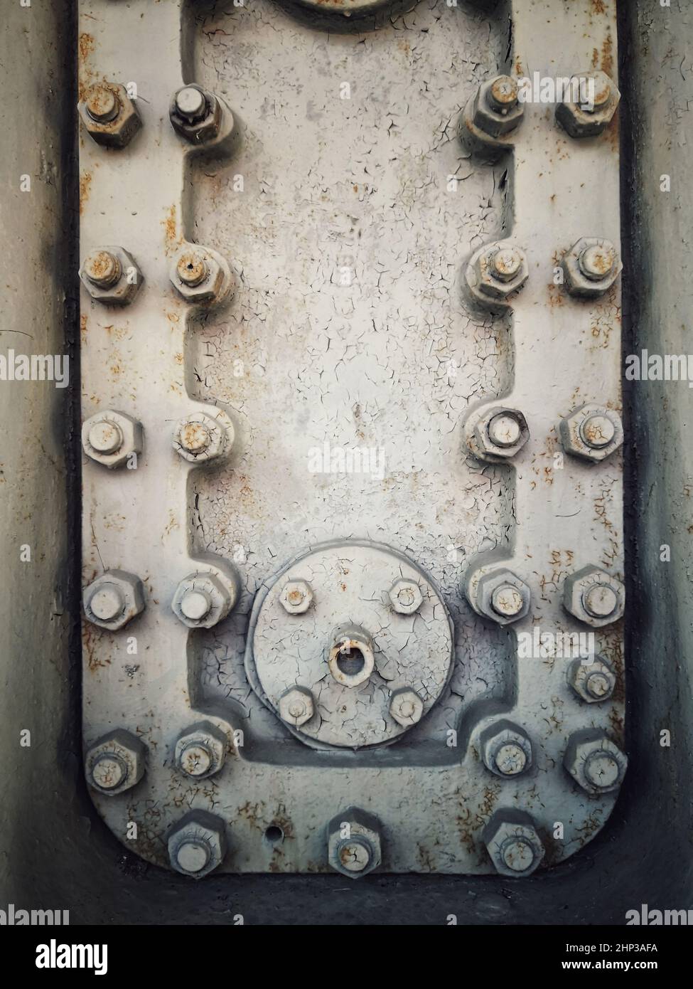 A grungy rusty steel hatch door secured with nuts and bolts Stock Photo ...