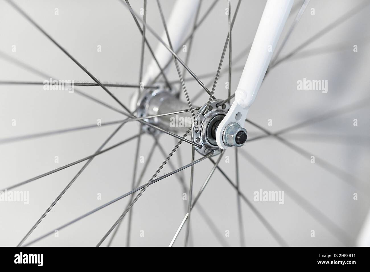 Bicycle wheel closeup front axle hub and fork Stock Photo - Alamy