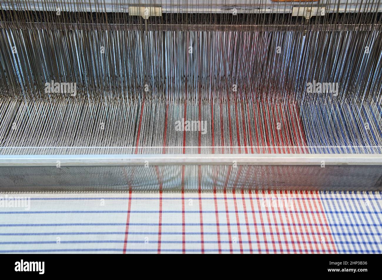 Weaving loom industrial textile production at work Stock Photo - Alamy