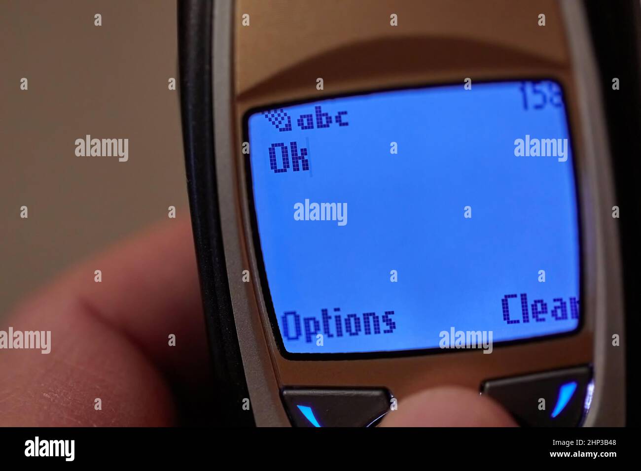 Sms text message saying OK on an old cellphone display, extra brief ...