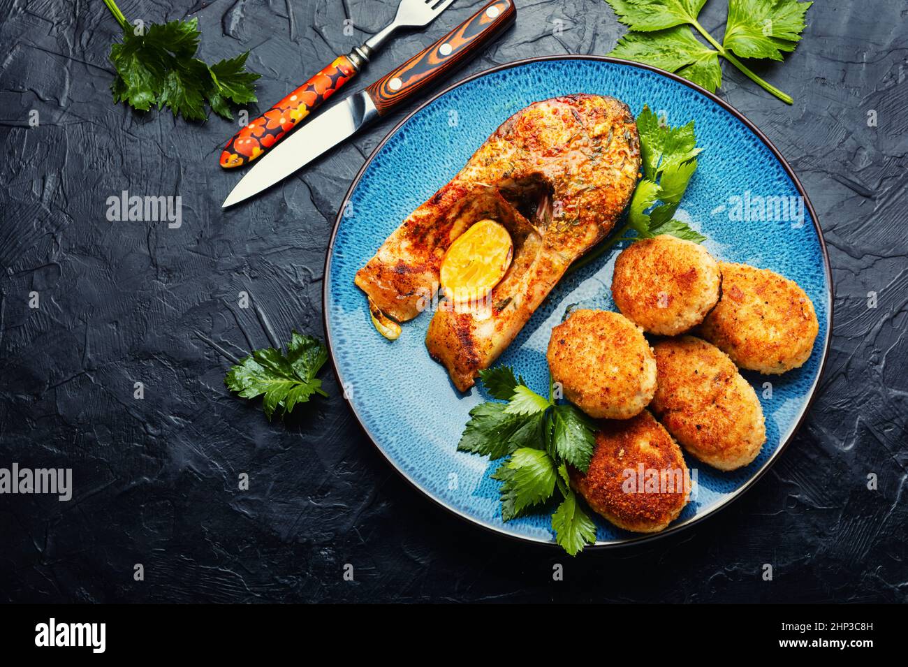 Homemade minced fish cutlets and fish steak. Copy space Stock Photo - Alamy
