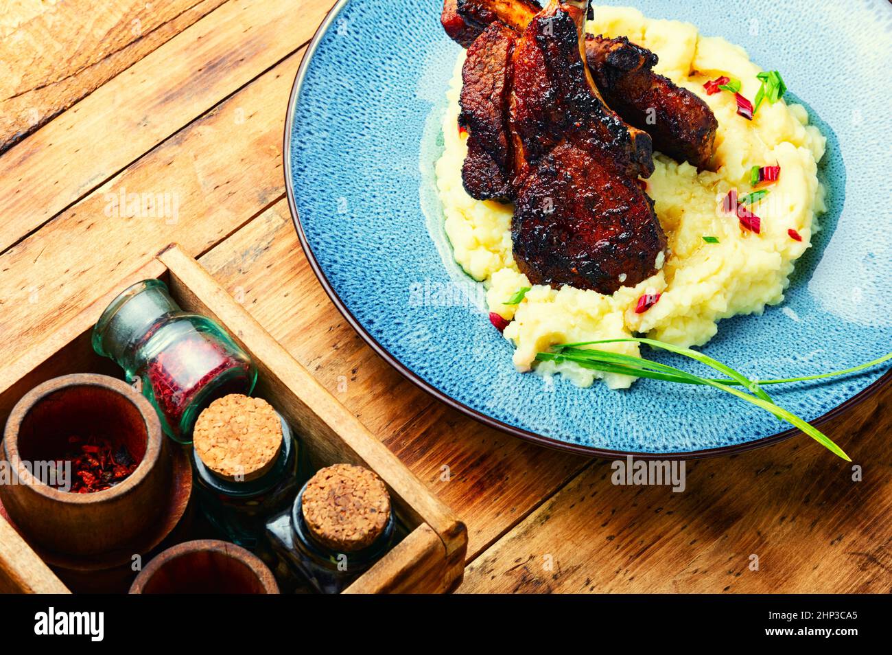 Grilled meat steak on the bone and mashed potatoes Stock Photo - Alamy