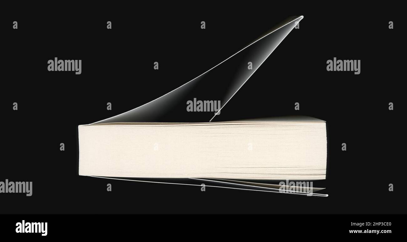 Elegant partially open book over dark background Stock Photo - Alamy