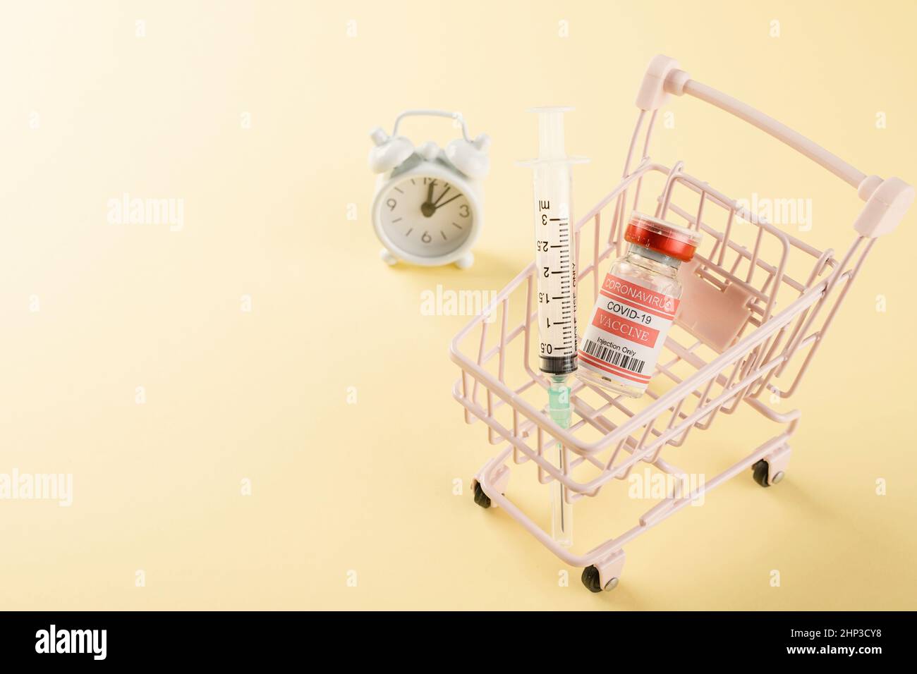 Shopping cart with vaccine vials bottles and syringes for vaccination ...