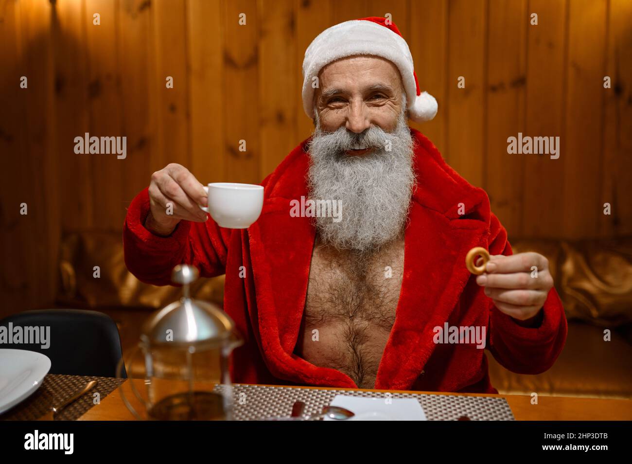 Headshot portrait of happy smiling Santa Claus drinking tea and eating ...