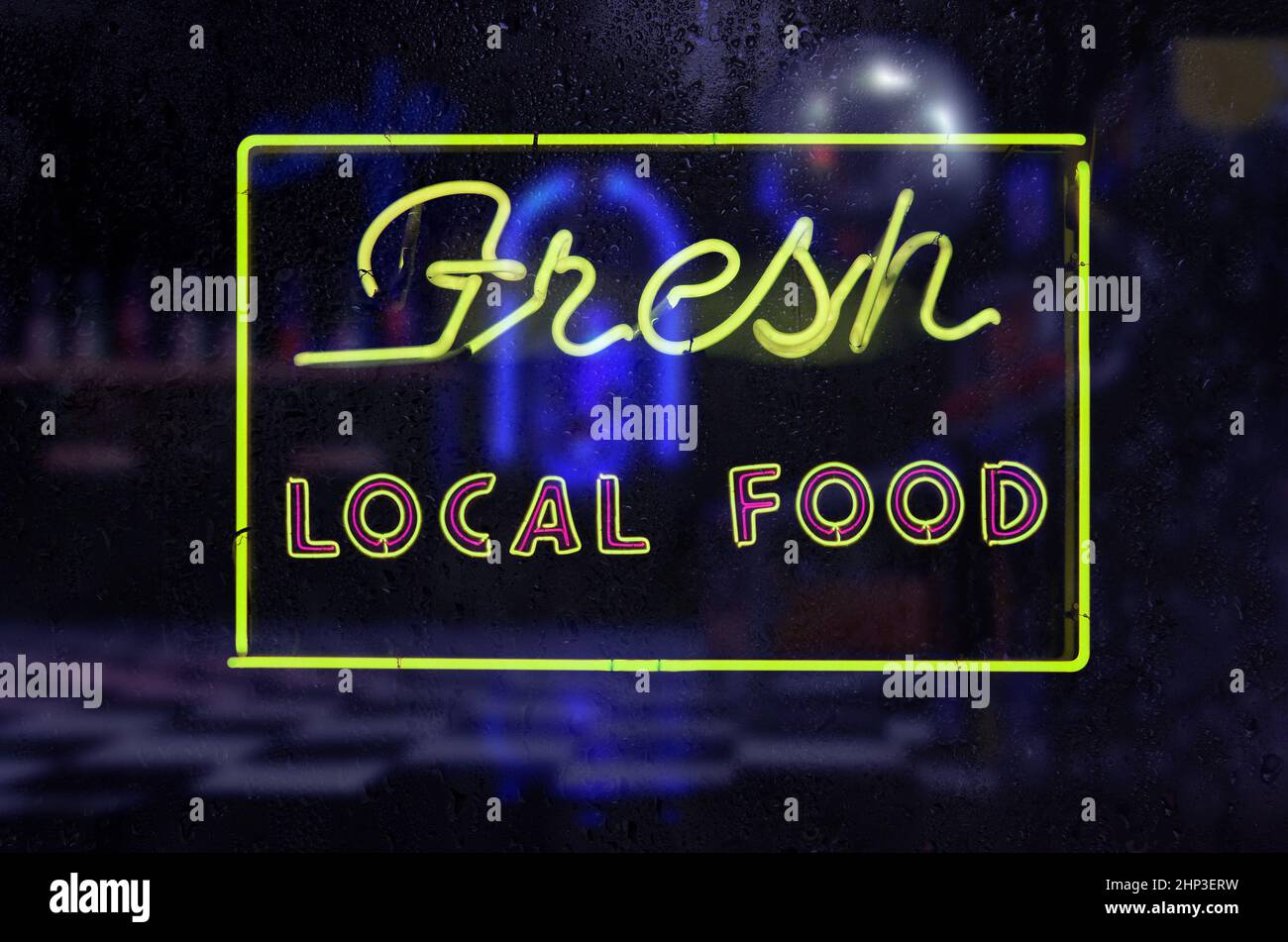 Vintage Neon Fresh Local Food Sign in Rainy Window Stock Photo - Alamy