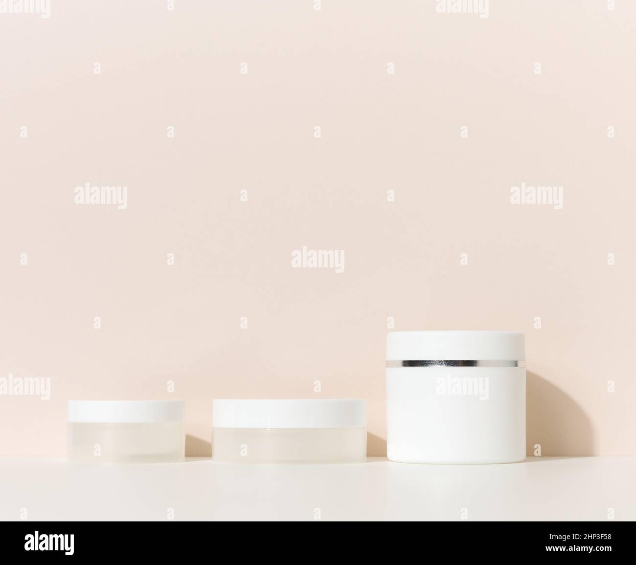 white round plastic jar for cosmetic products. Blank for branding ...