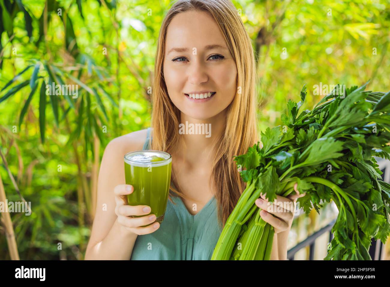 Young woman drinks Celery Juice, Healthy Drink, bunch of celery on a ...