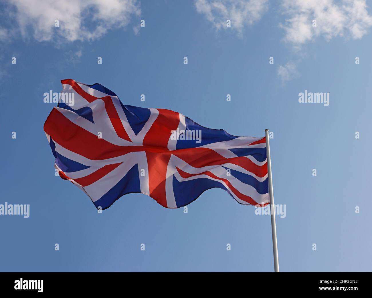 UK Great Britain national flag flying and waving in the wind over clear ...