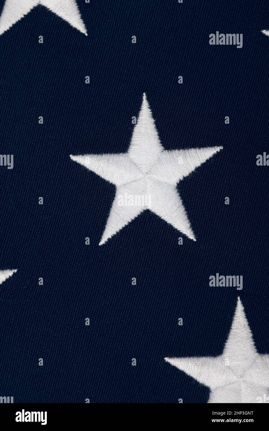 Close up embroidered white stars on blue canton of heavy cotton canvas ...