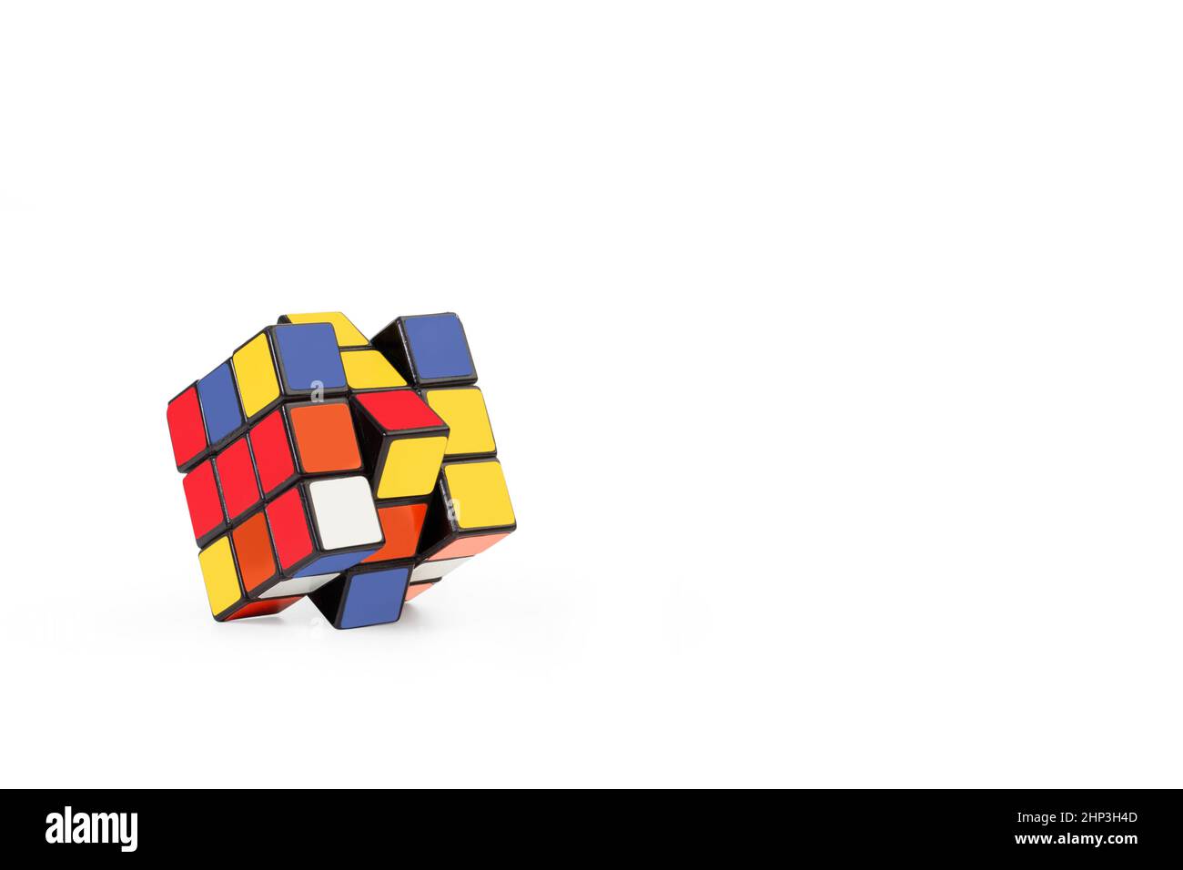 A Rubik cube on a white background with copy space Stock Photo - Alamy
