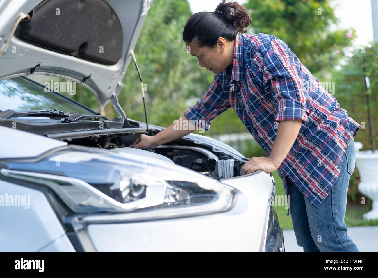 Open hood mechanic engine system to check and repair damage car crash ...