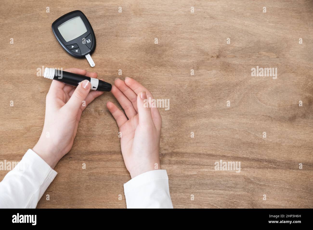 Diabetes checking blood sugar level. Child using lancelet and ...