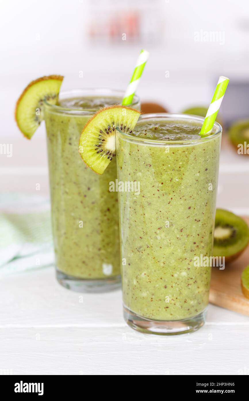 Green smoothie fruit juice kiwi drink in a glass portrait format ...