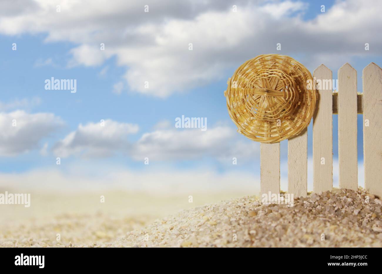 Fence on beach with waves and sky in background Stock Photo - Alamy