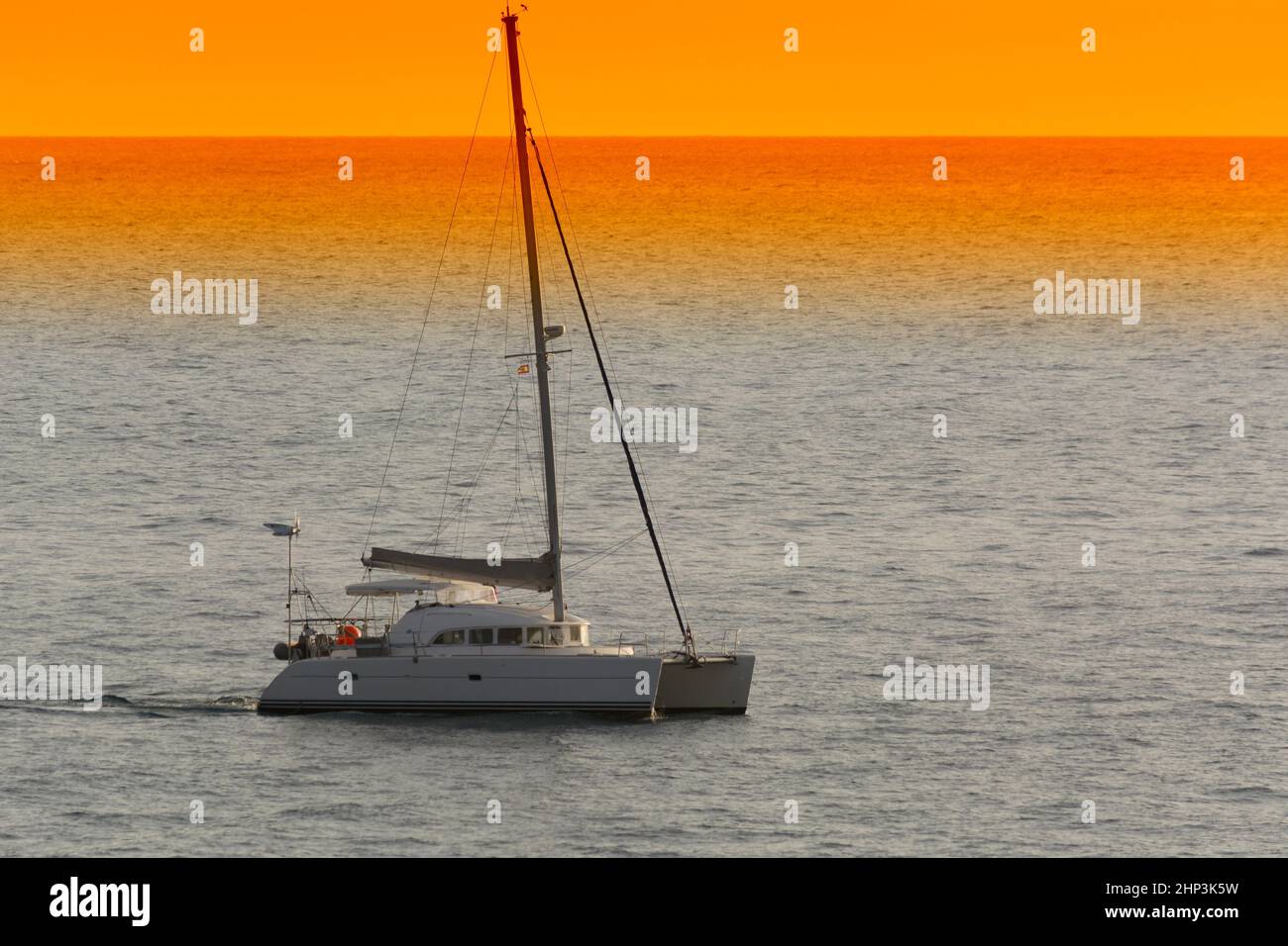 Yacht - catamaran in the tropical sea at sunset. Yachting / luxury ...