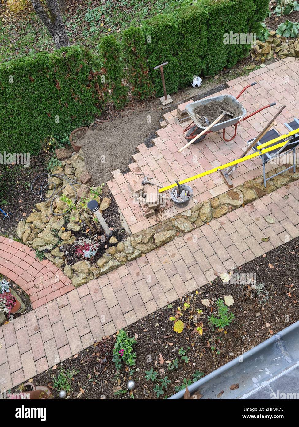 Worker laying pavement rocks Stock Photo - Alamy