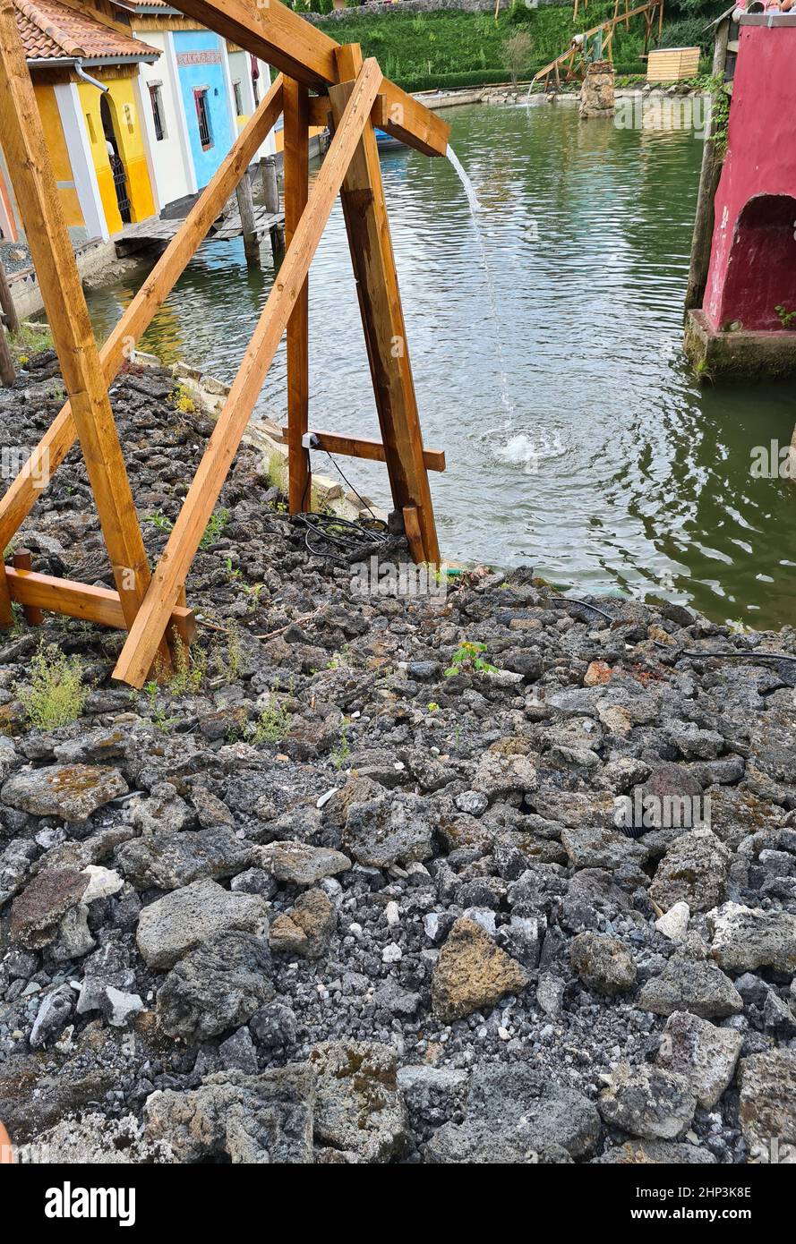 Wooden rainwater inlet into a lake Stock Photo - Alamy