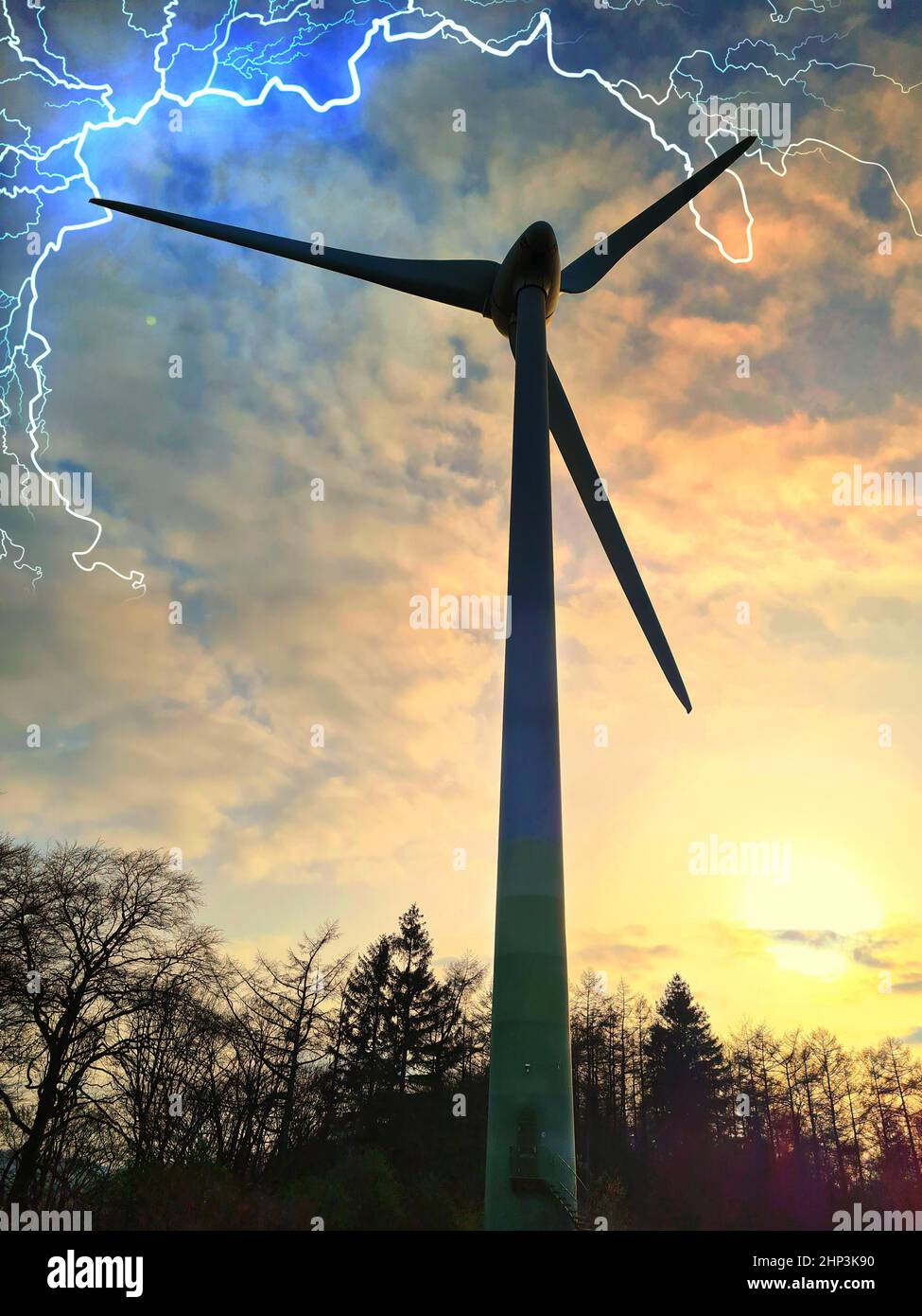 Wind turbine in the countryside during a thunderstorm and storm, rainy ...