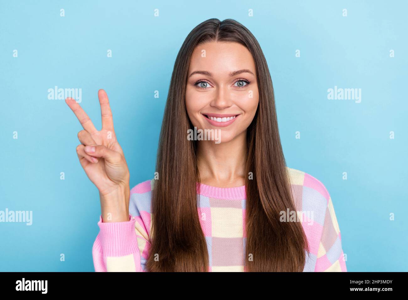 Photo of cheerful friendly lady show v-sign toothy smile wear casual ...