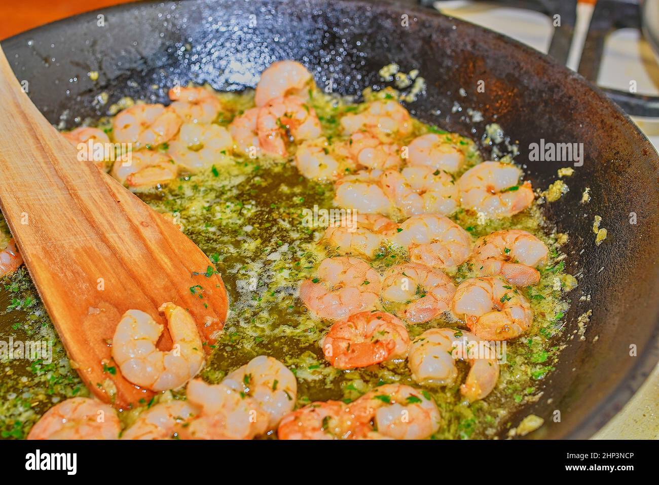 Frying of prawns on pan. Food photography. Close up Stock Photo - Alamy
